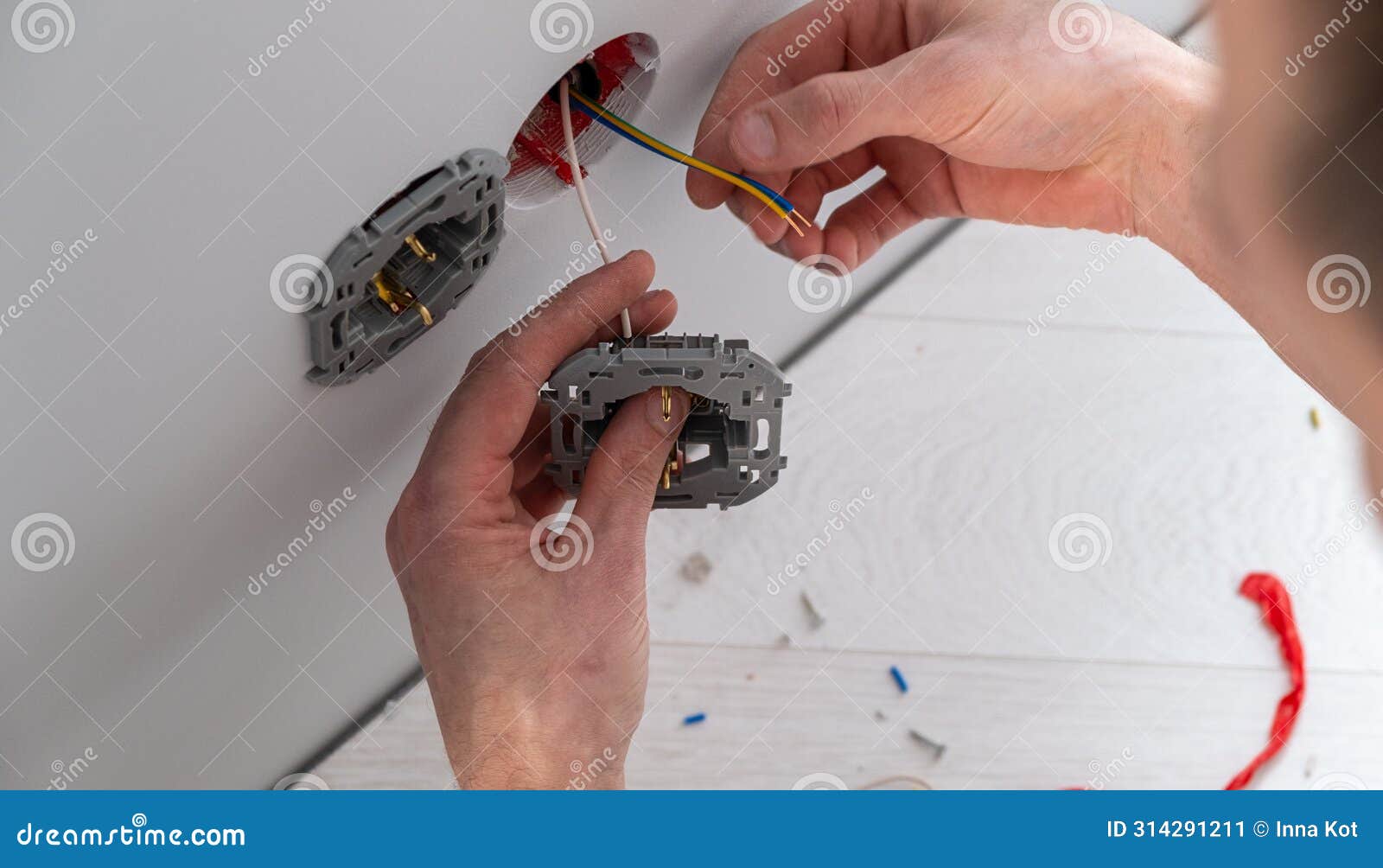 Professional Electrician Working on a Home Electrical System, he is ...