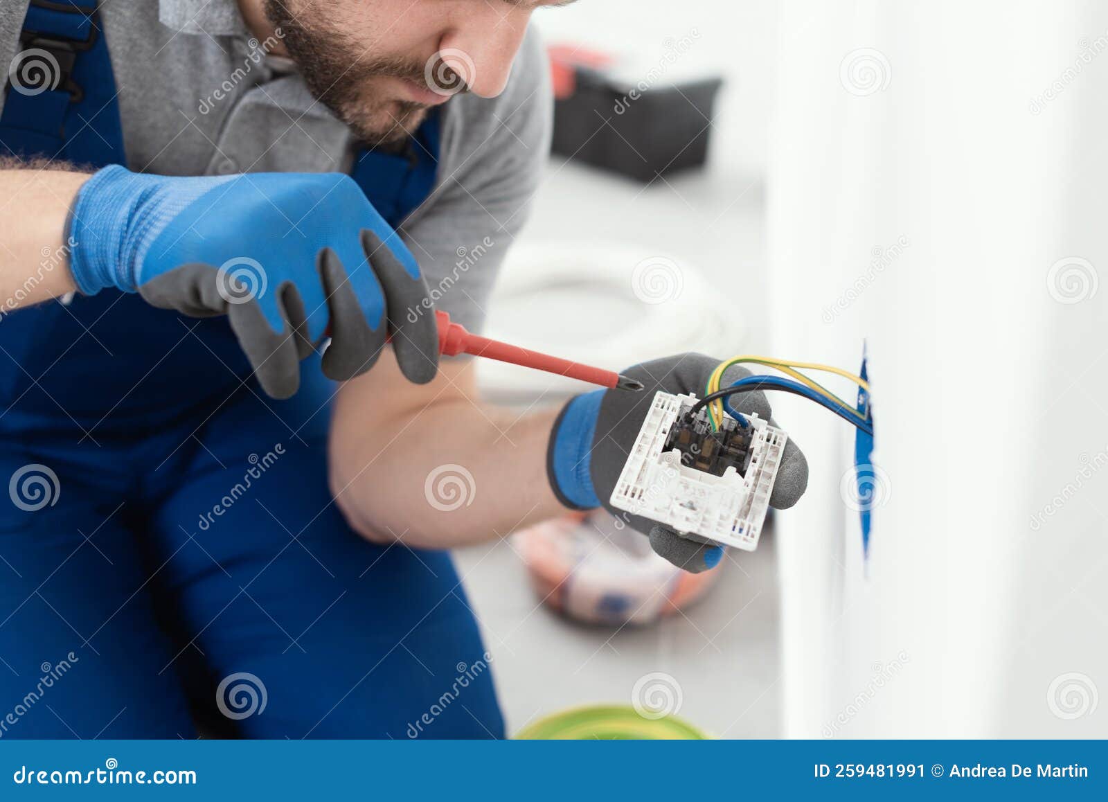 Professional Electrician Installing a Wall Socket Stock Image - Image ...