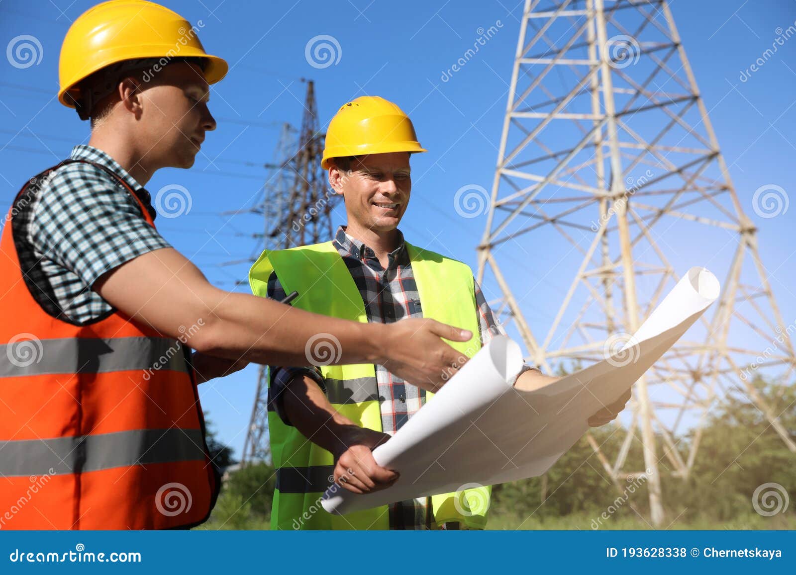 Electricians with Drafting Near High Voltage Tower Stock Photo - Image ...