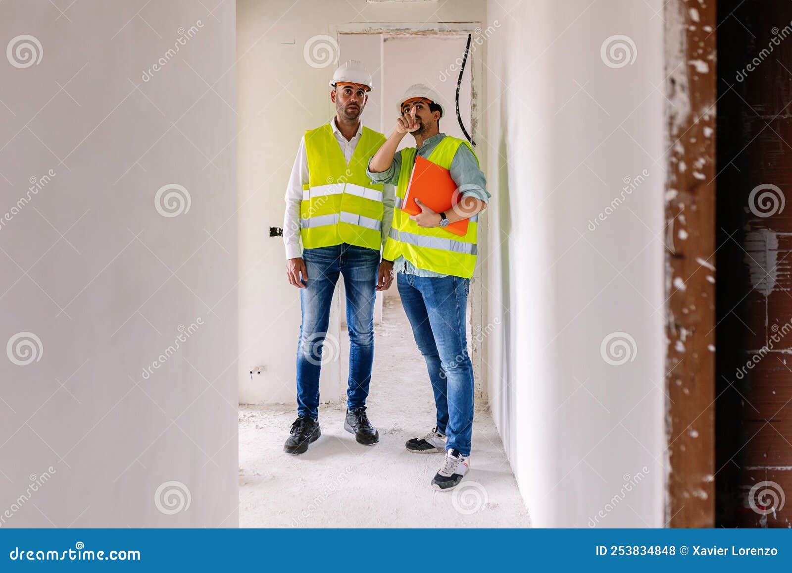 Professional Engineer Architect Workers in Conversation at Construction ...