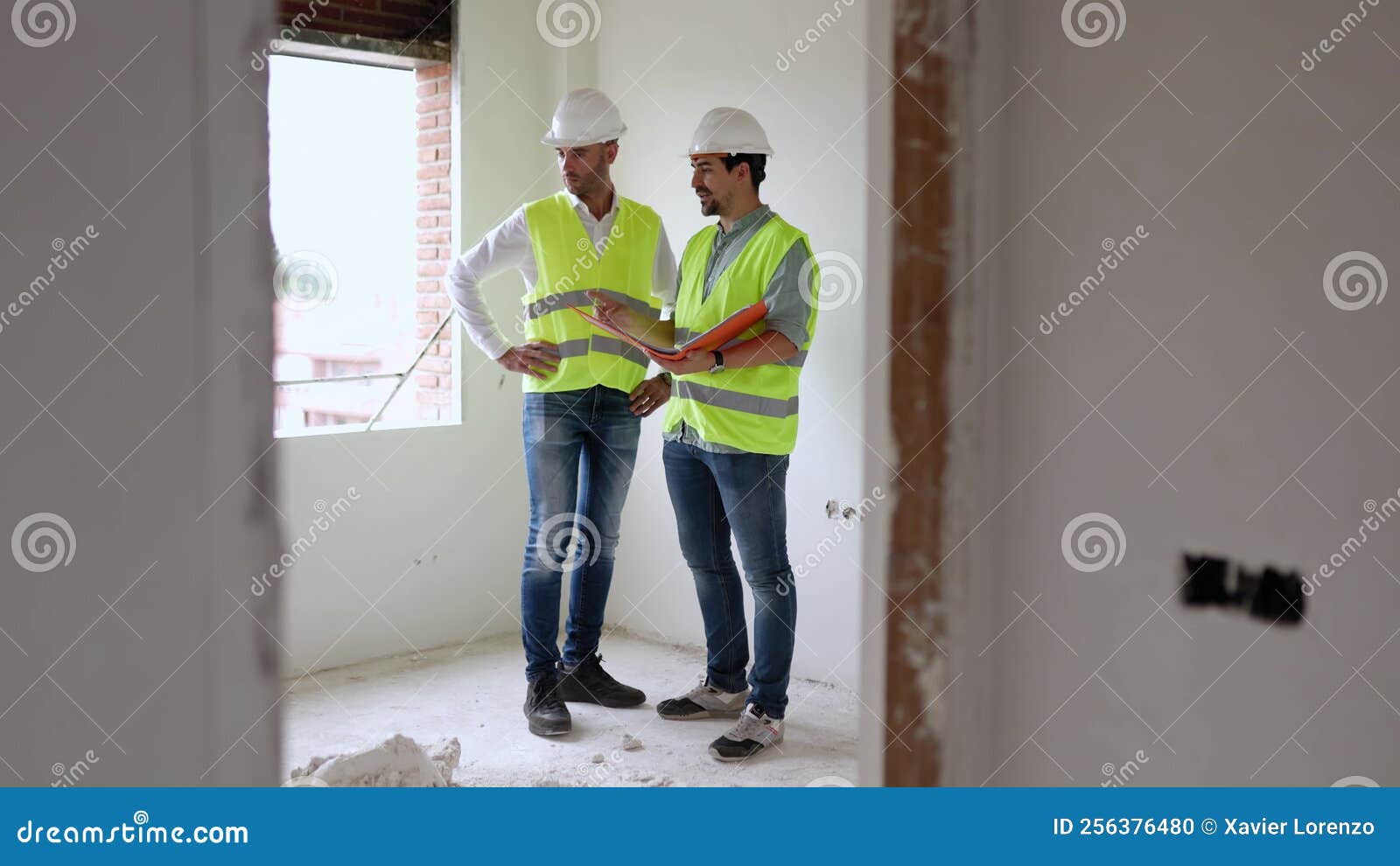 Professional Engineer Architect Workers in Conversation at Construction ...
