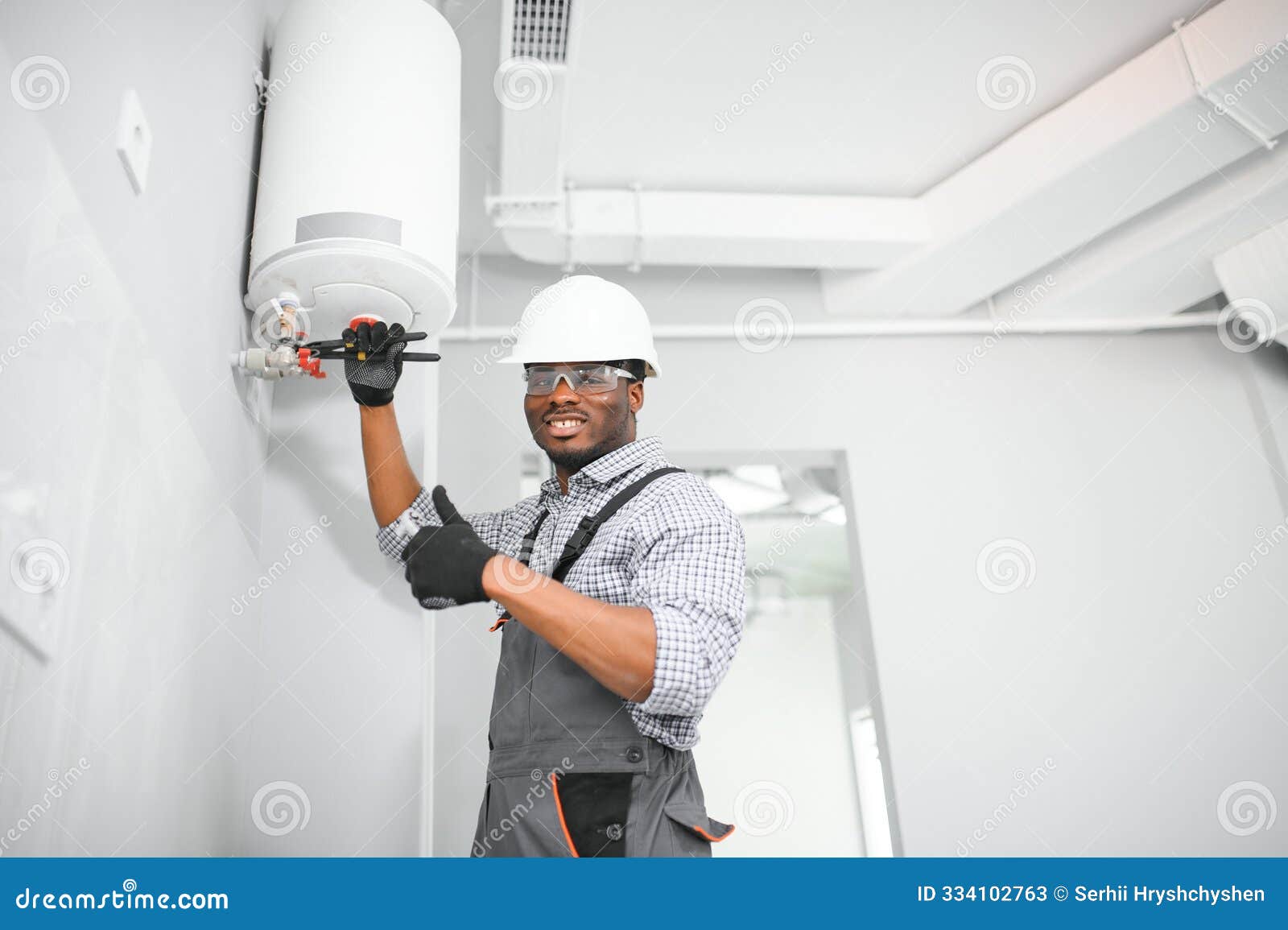 Professional African American Engineer Doing a Boiler Inspection at ...