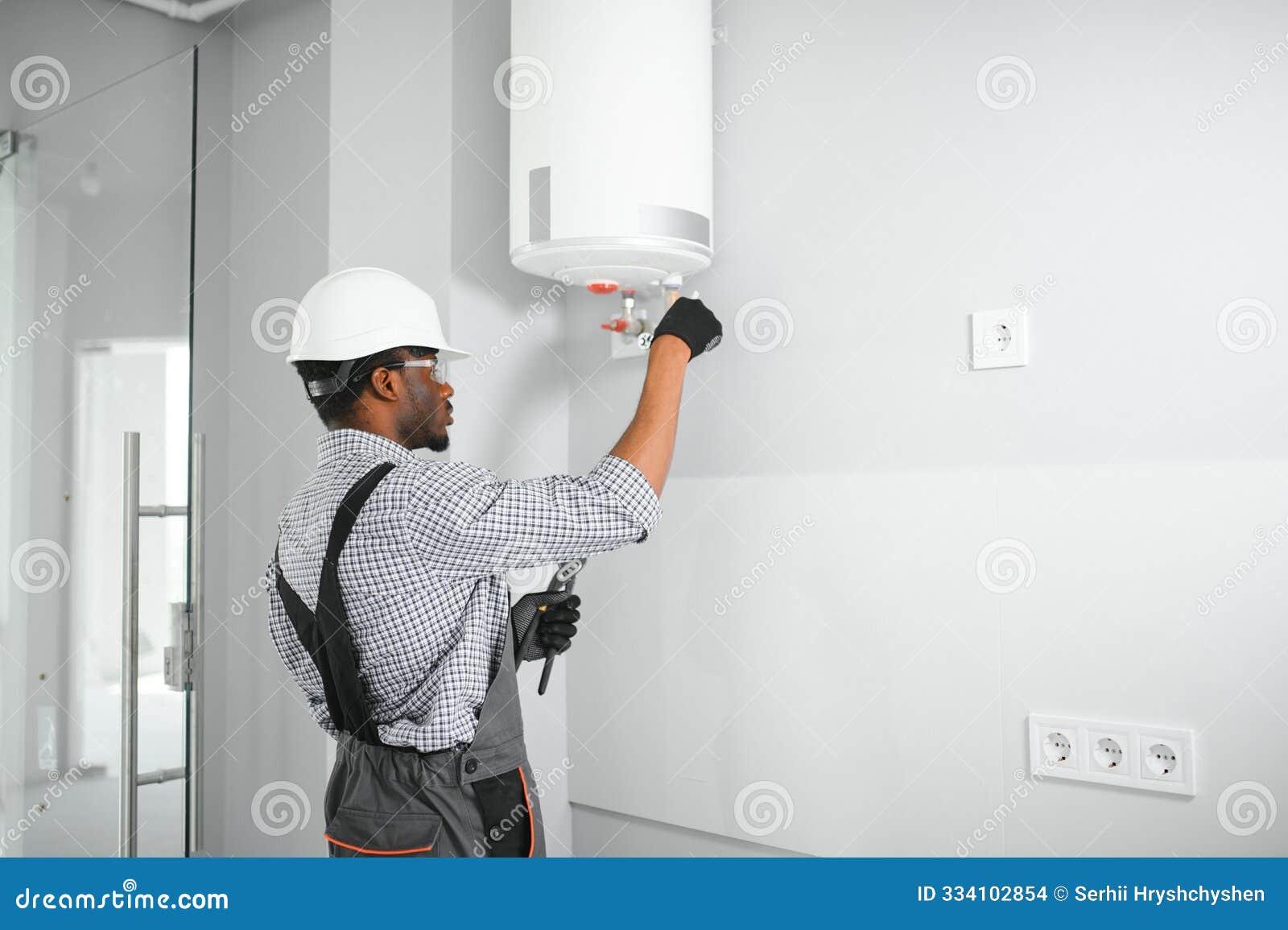 Professional African American Engineer Doing a Boiler Inspection at ...
