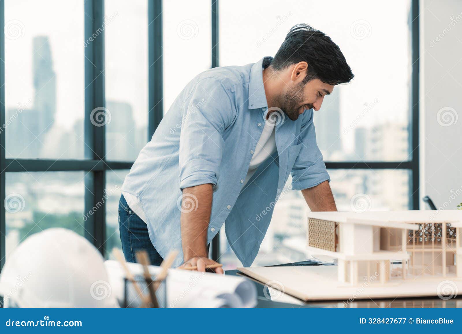 Professional Engineer Inspecting House Model while Designing Building ...