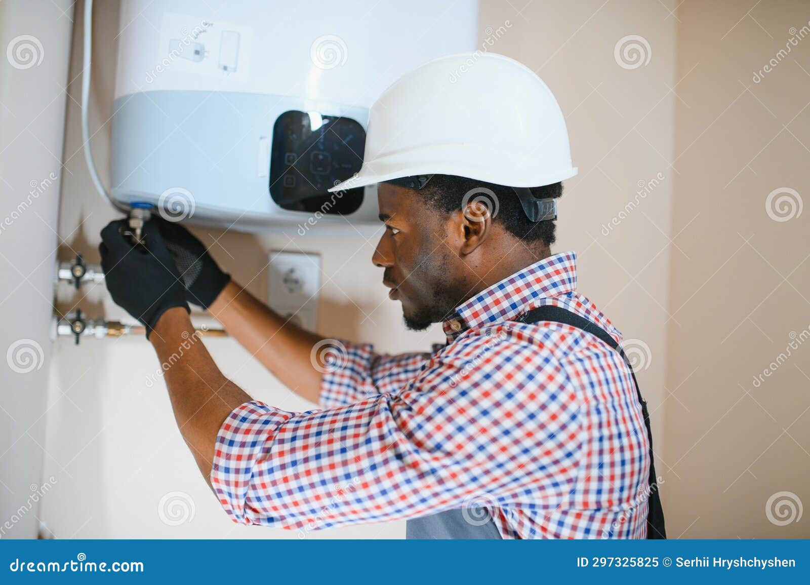 Professional Engineer Installing a Natural Gas Boiler at Home, he is ...