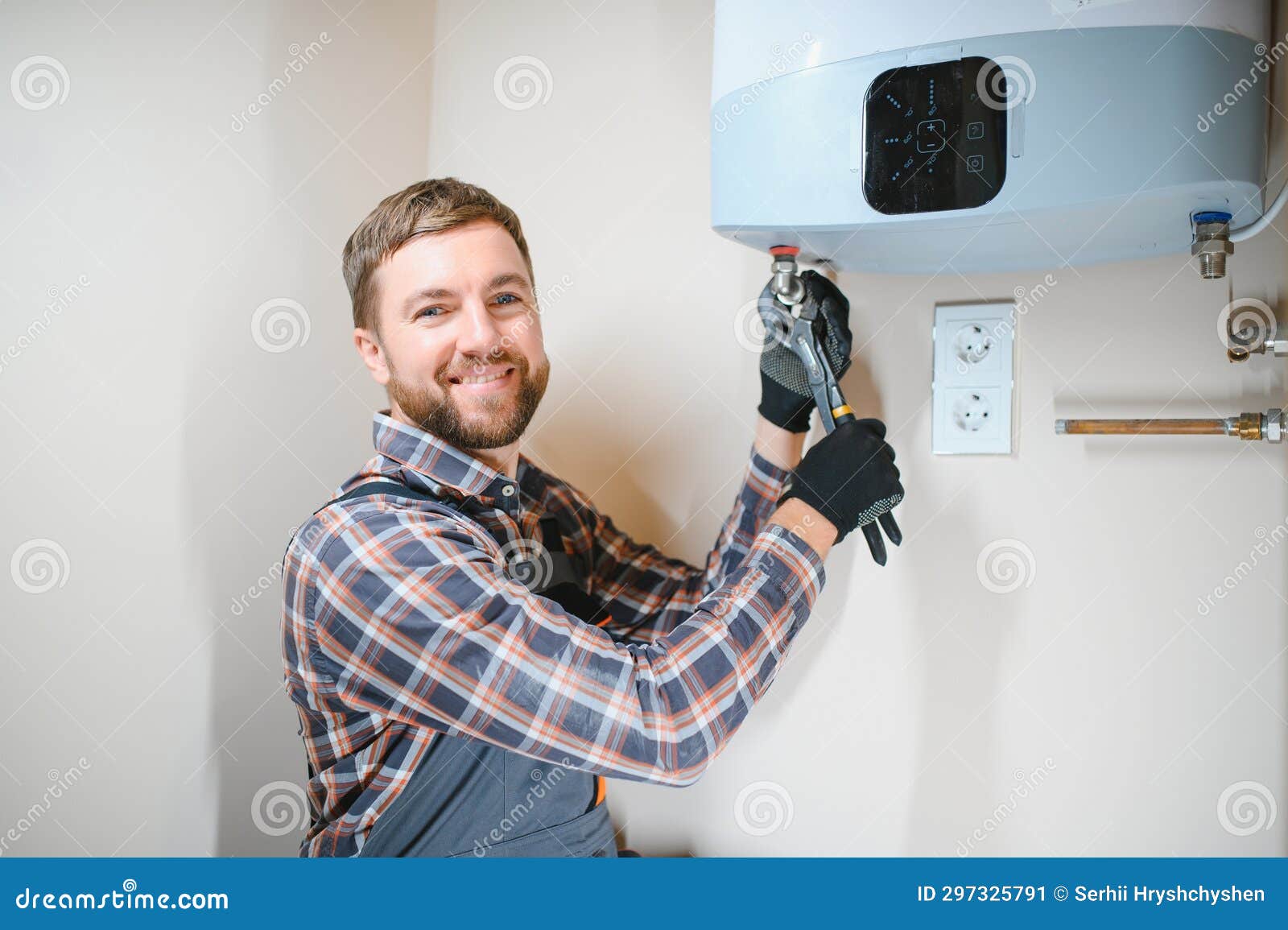 Professional Engineer Installing a Natural Gas Boiler at Home, he is ...