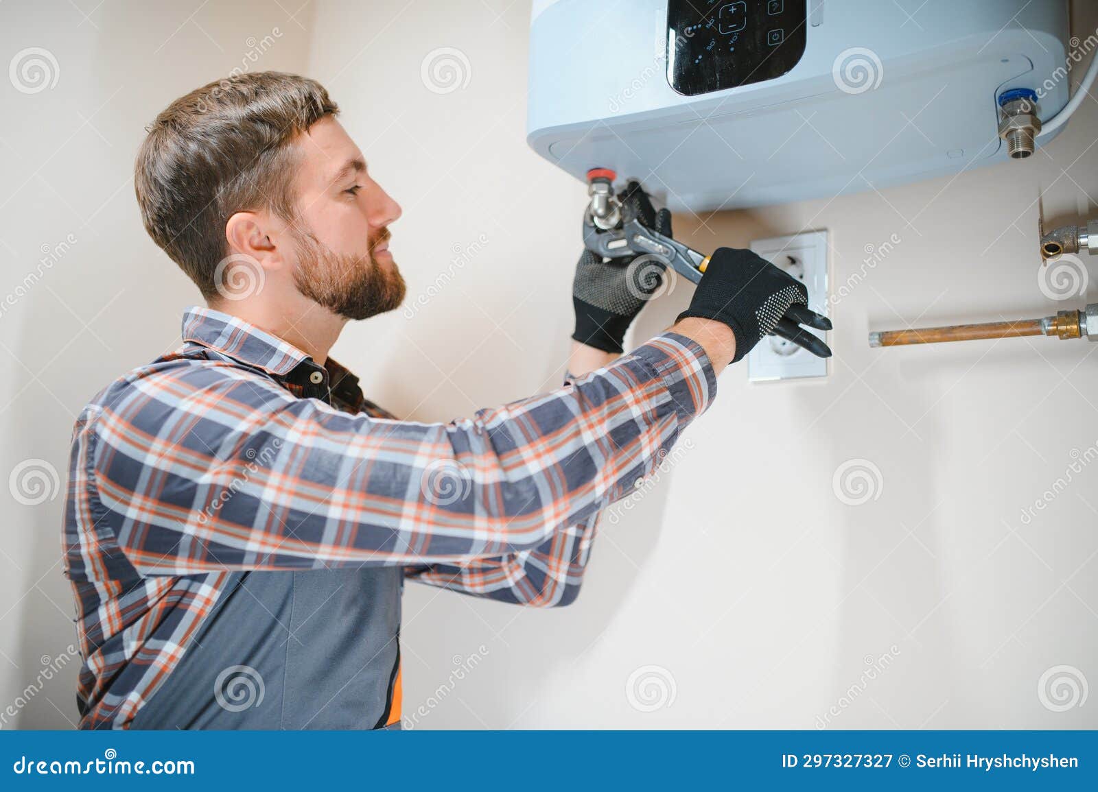 Professional Engineer Installing a Natural Gas Boiler at Home, he is ...