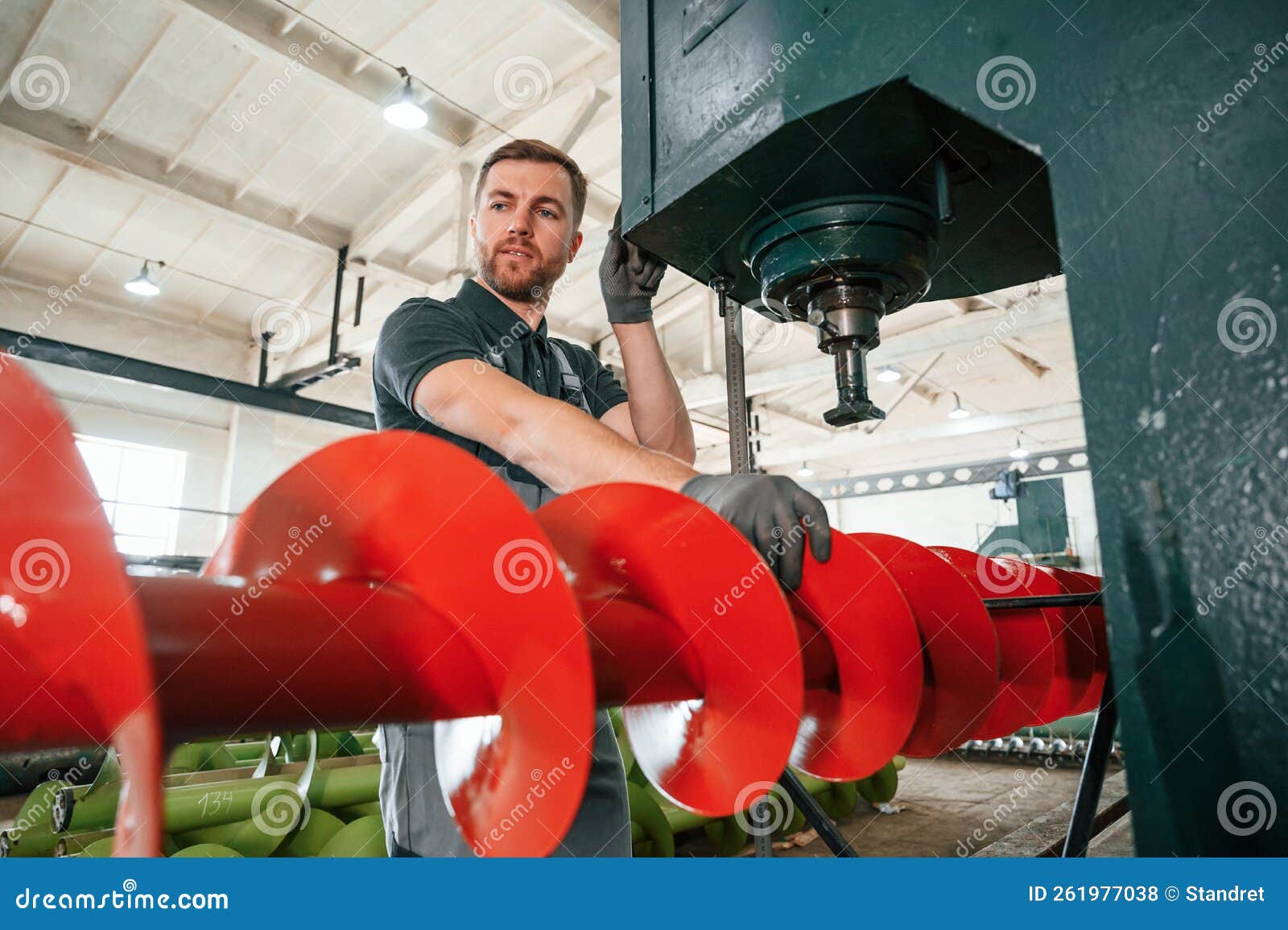 Professional Engineer Operating Machine. Man in Uniform is in ...