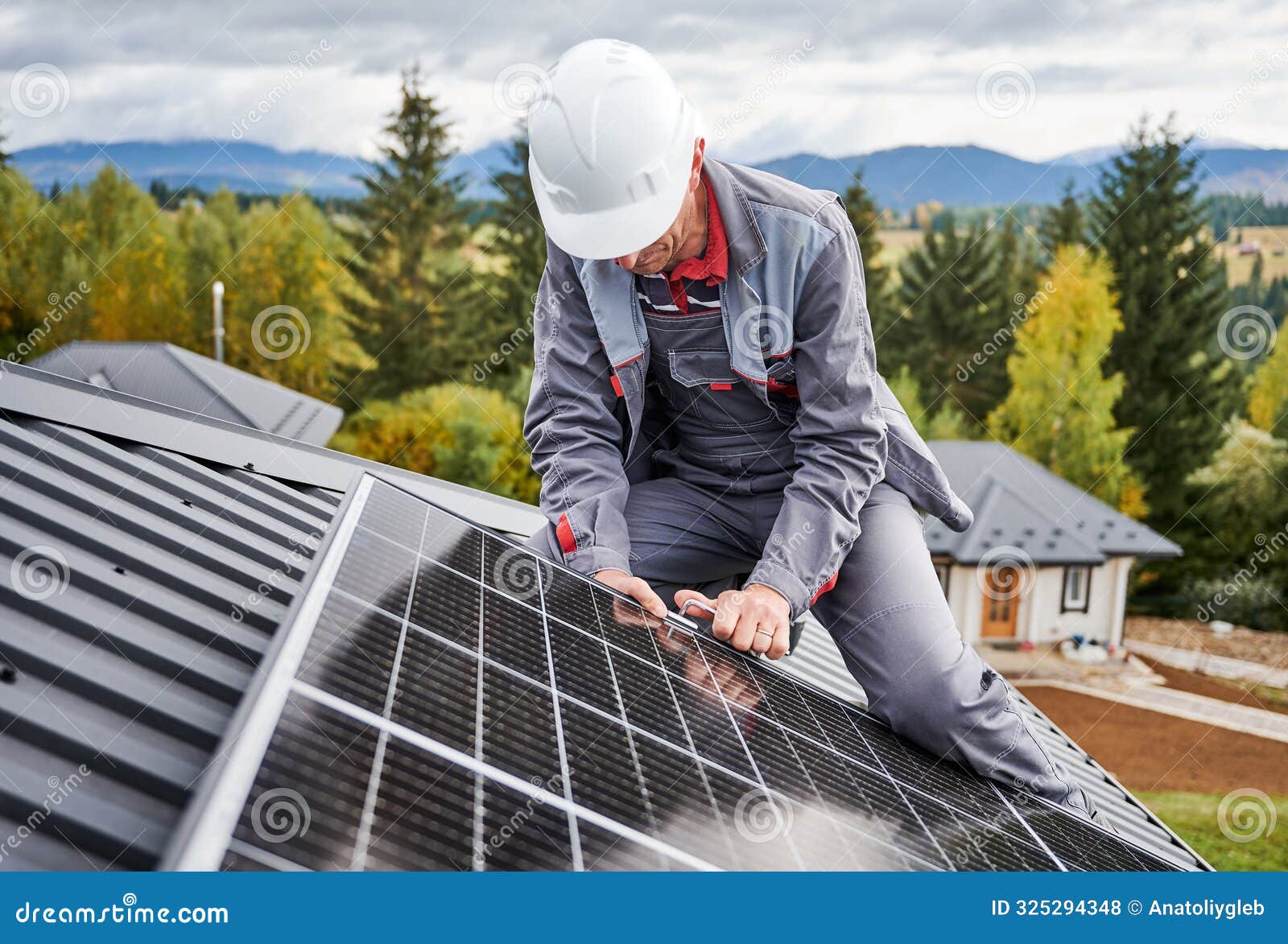 Professional Engineer Securing Solar Cell on Roof by Hexagon Tool Stock ...