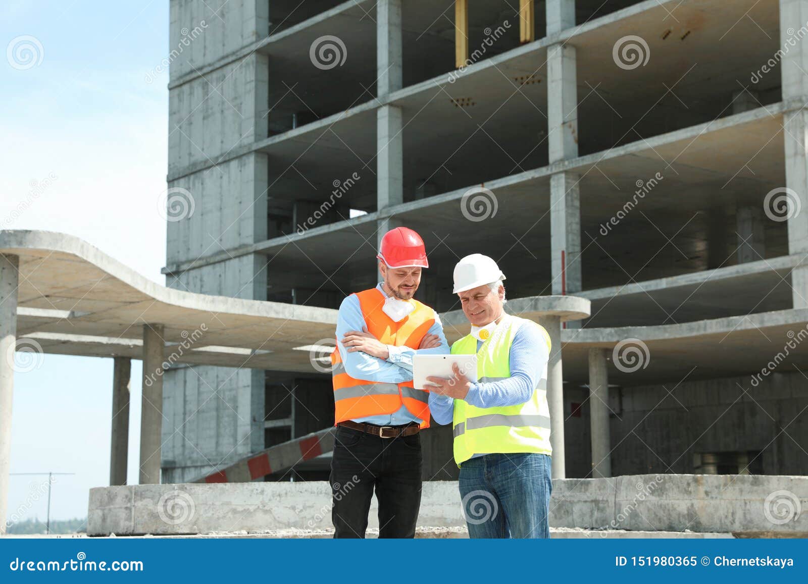 Professional Engineer with Tablet and Foreman in Safety Equipment Stock ...