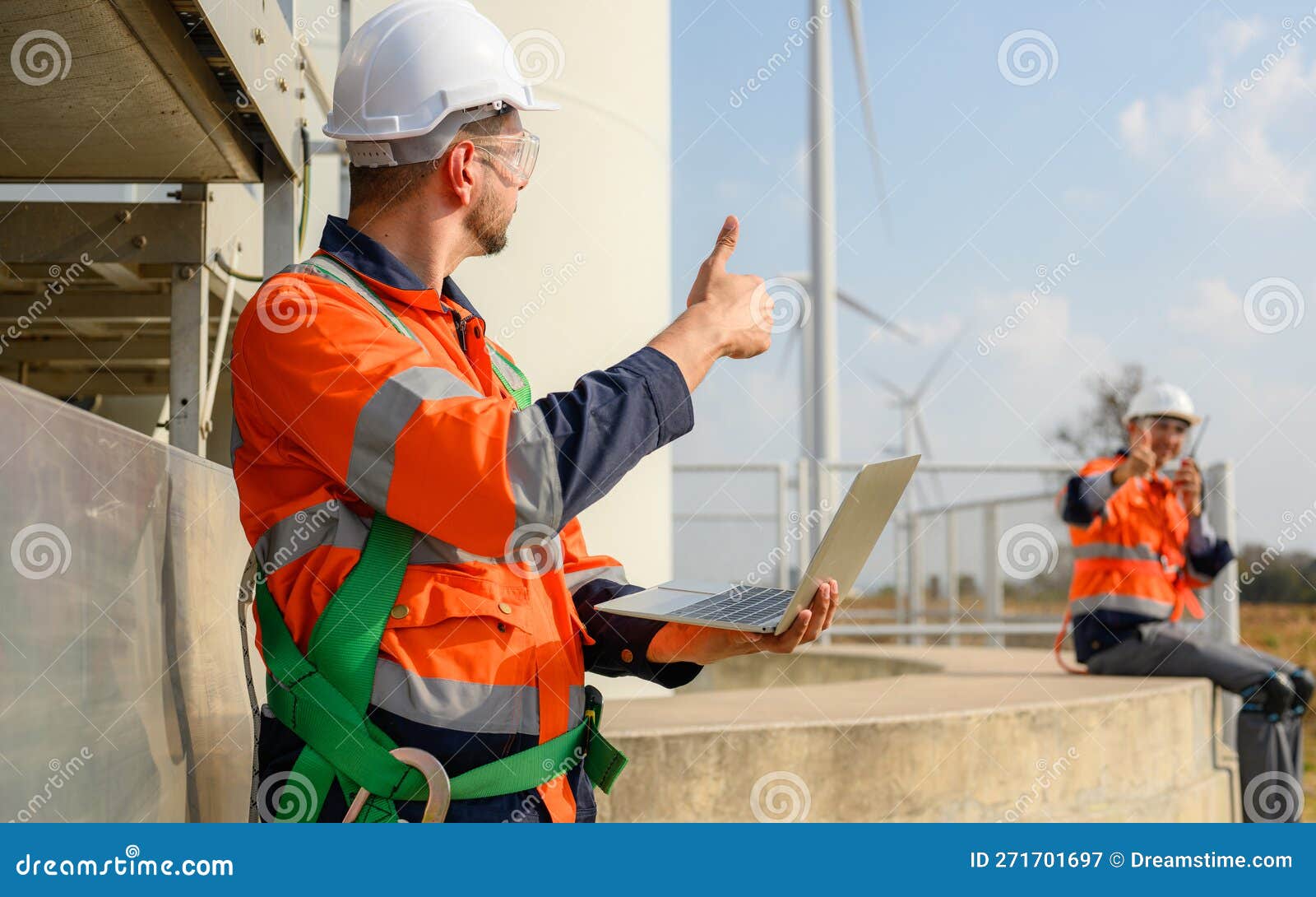Professional Engineer Technician Team Working at Wind Turbine Farm ...
