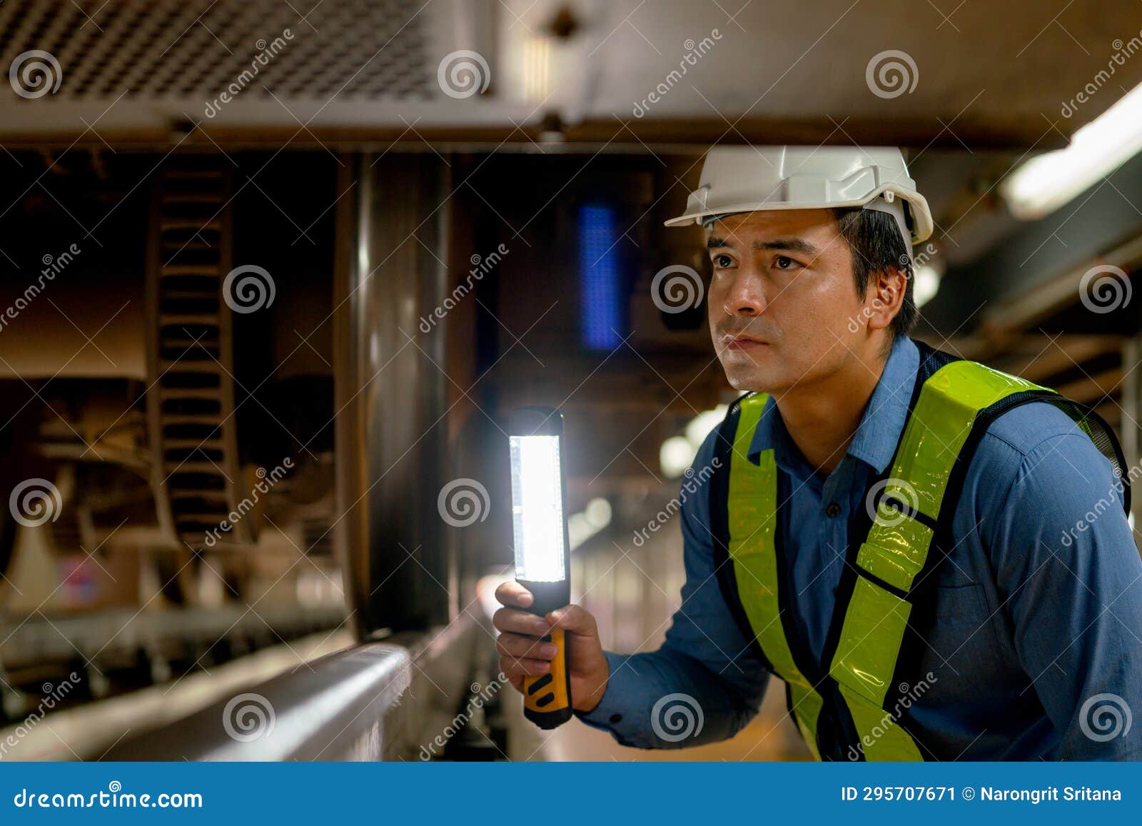 Professional Engineer Worker Check and Maintenance Under the Train with Use Light Tube To ...