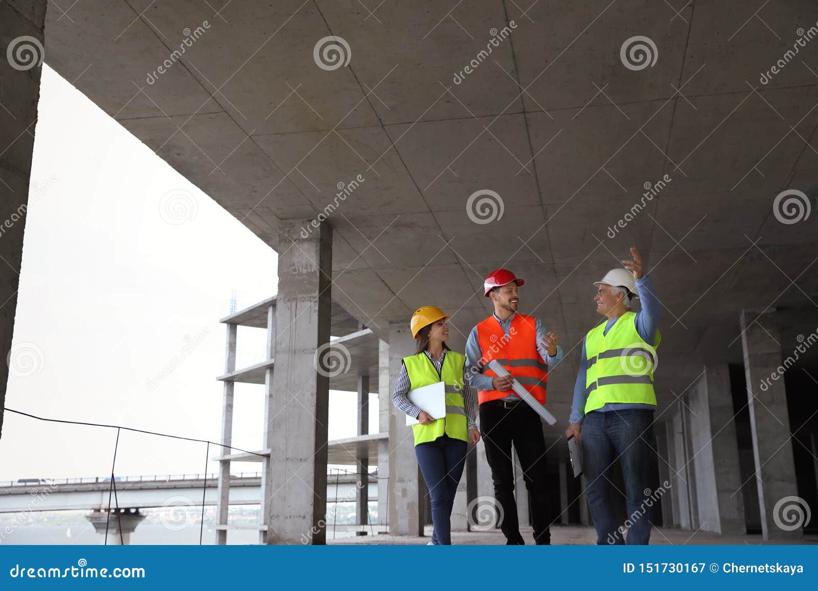 Professional Engineers in Safety Equipment at Construction Site Stock ...