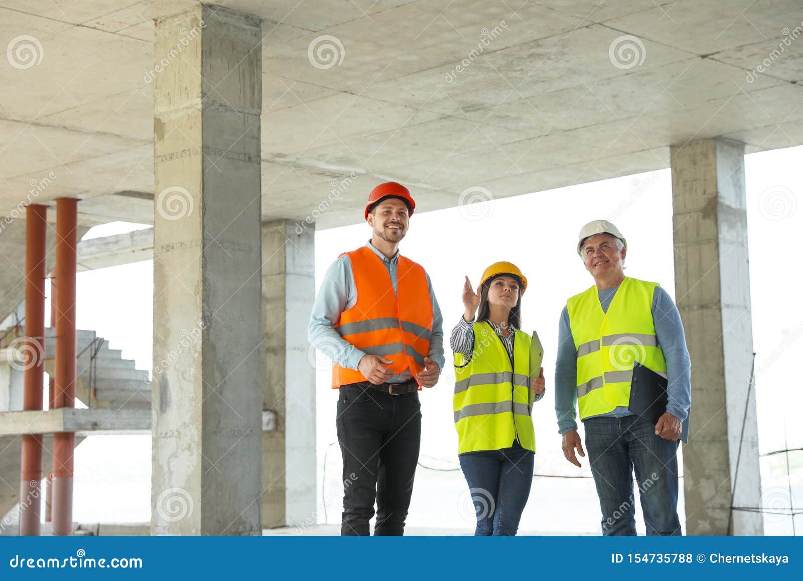 Professional Engineers in Safety Equipment at Construction Site Stock ...