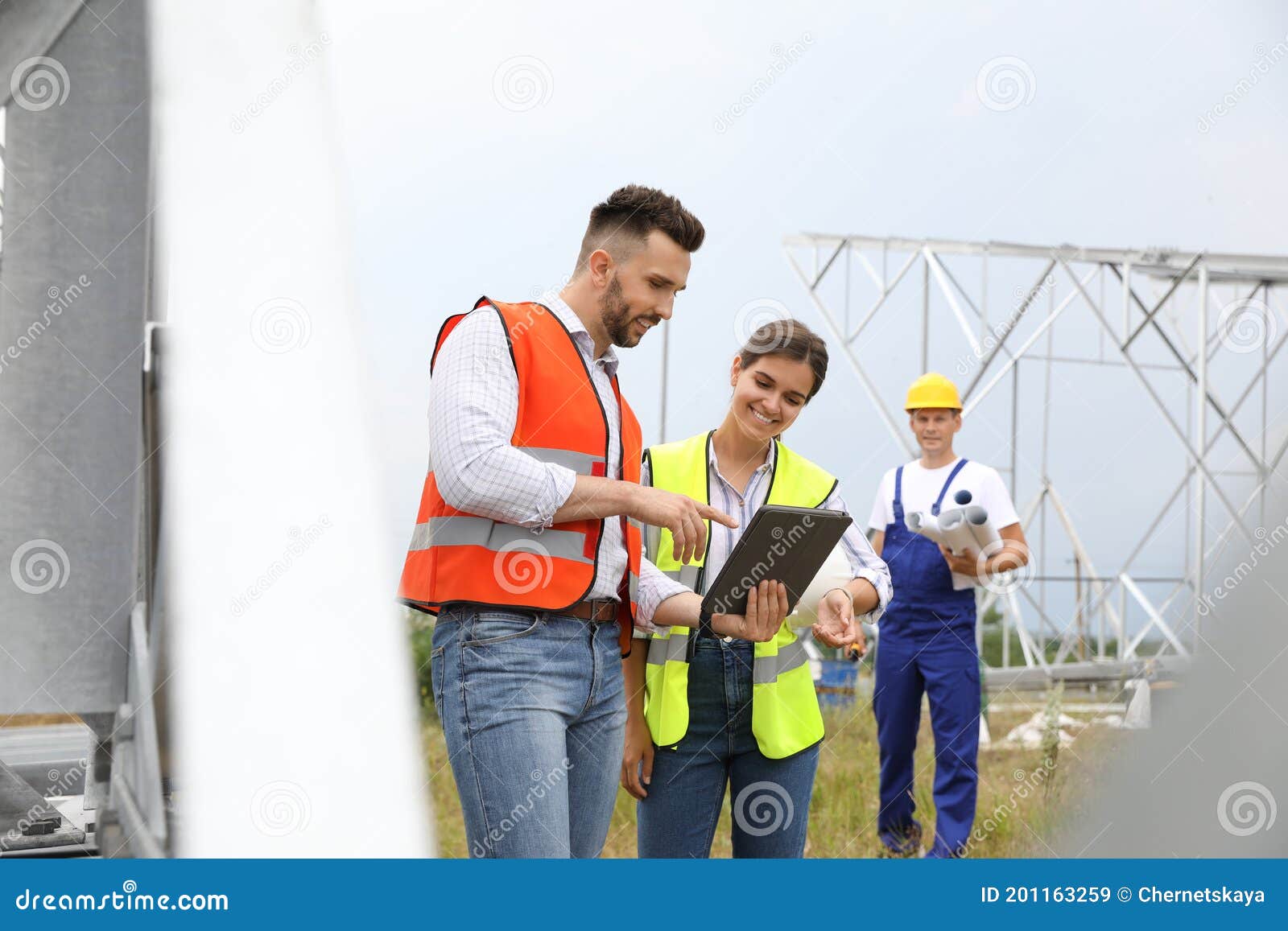 Professional Engineers Working on Installation of Electrical Substation ...