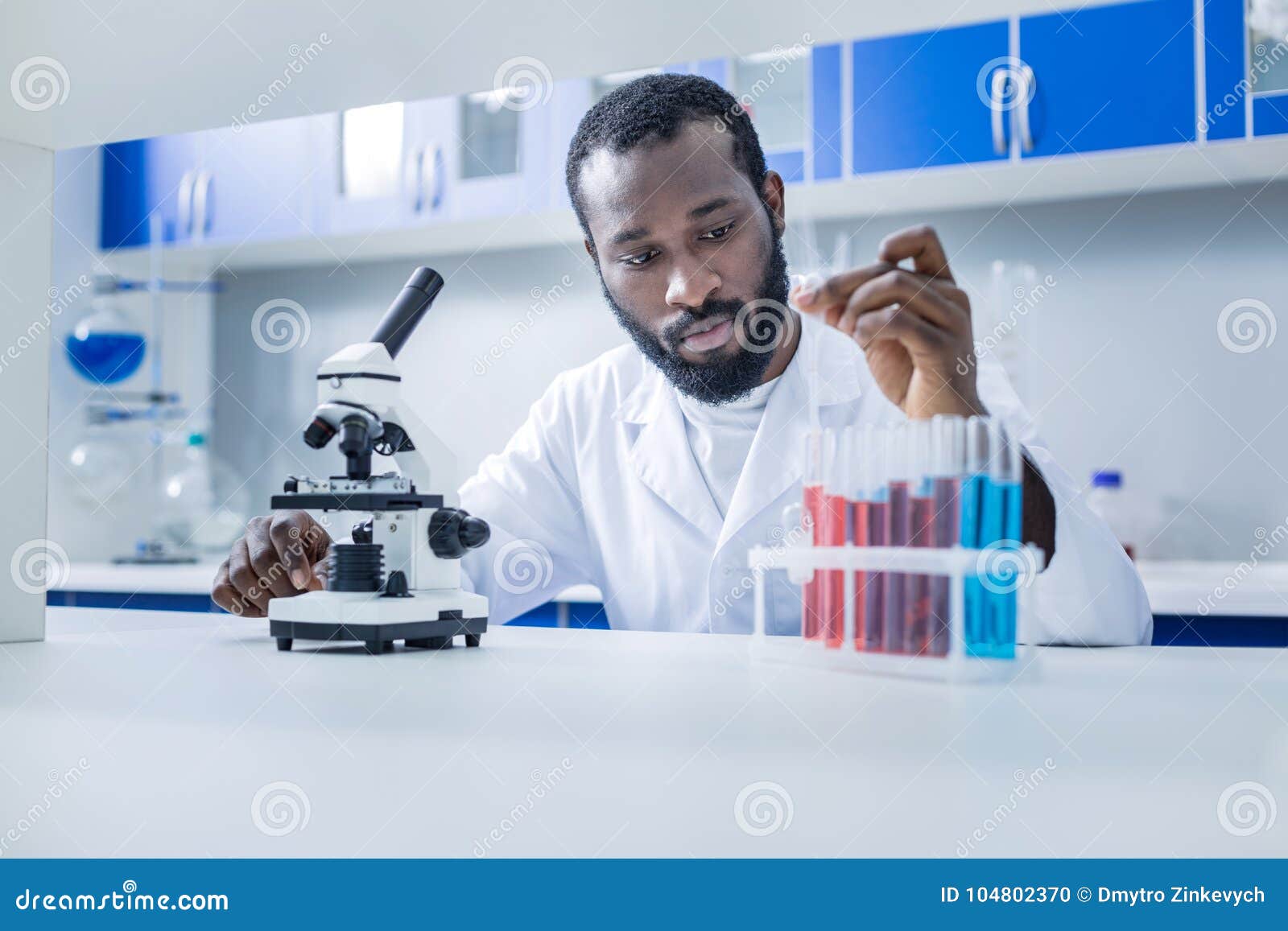 Smart Handsome Man Holding a Microscope Stock Photo - Image of ...