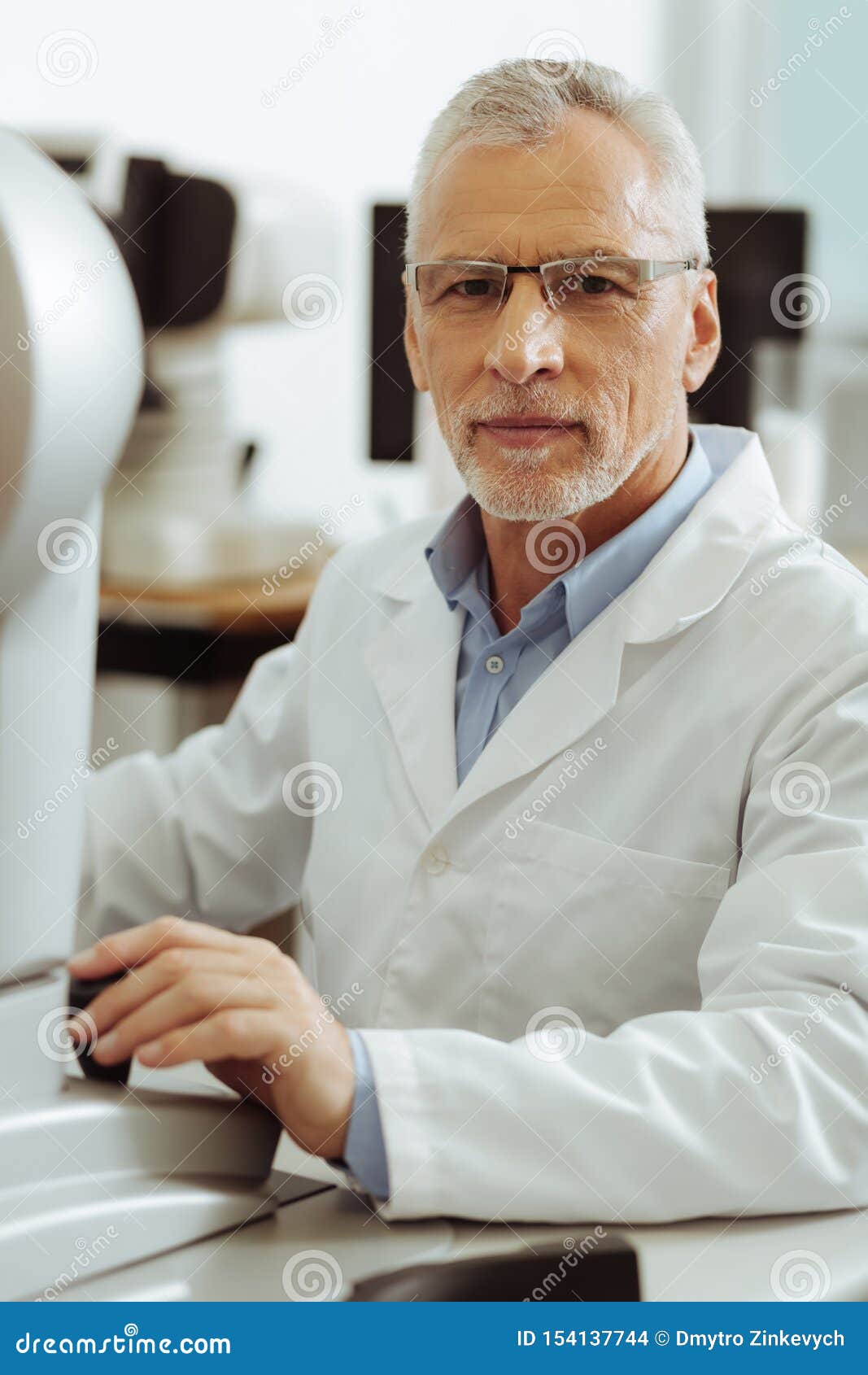 Professional Experienced Eye Doctor Sitting at the Table Stock Photo ...
