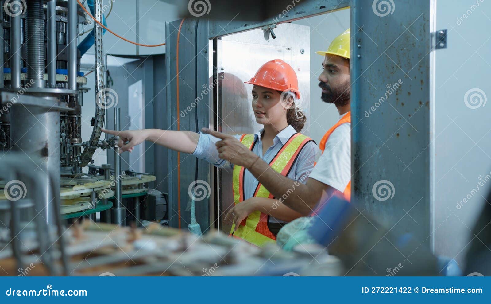 Professional Factory Manager Checking and Controlling Machine at ...