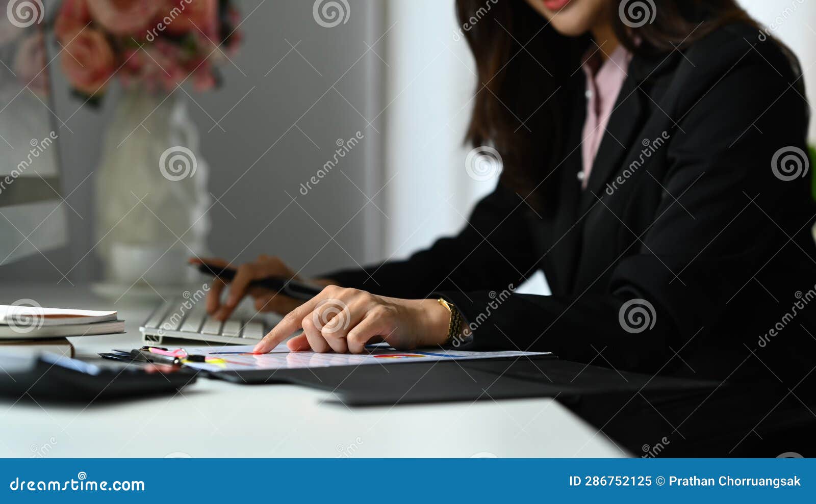 Professional Female Analyst Working with Graph and Statistic Document ...