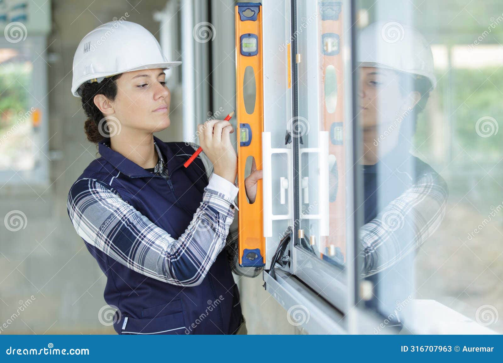 Professional Female Construction Worker Using Spirit Level Stock Image ...