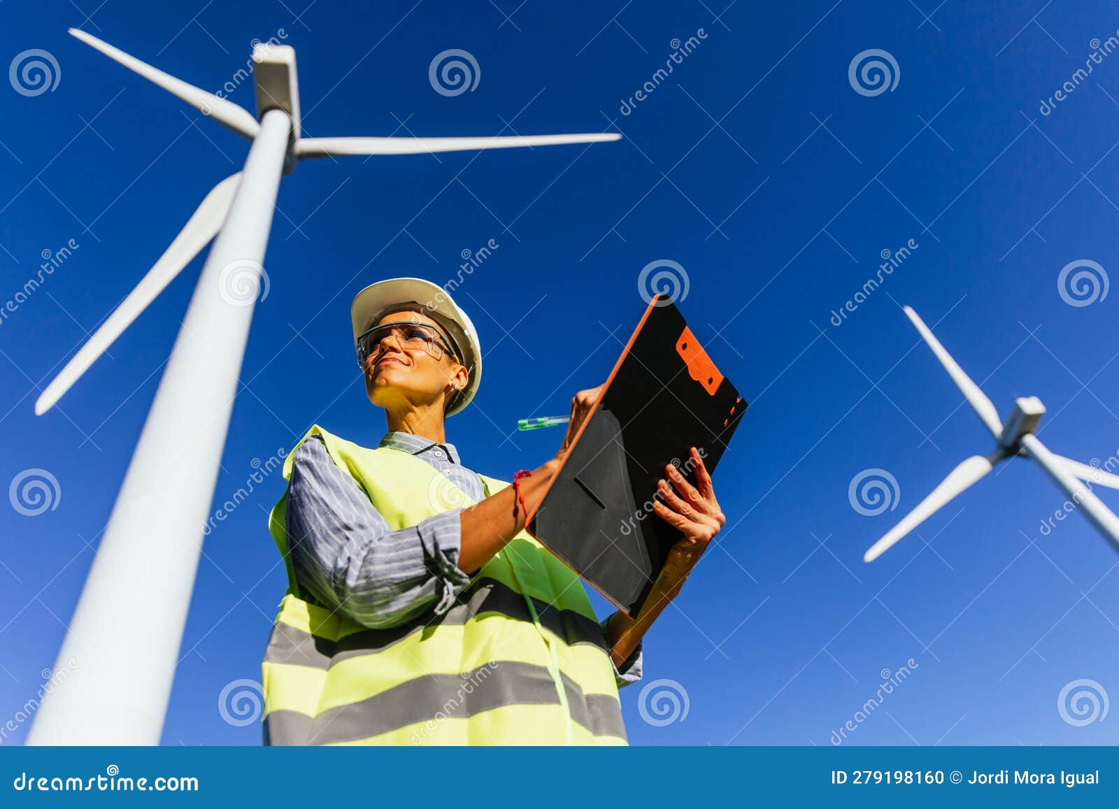 Professional Female Engineer Working in a Wind Turbine Field. Stock ... Professional Female Engineer Working in a Wind Turbine Field. Stock ...