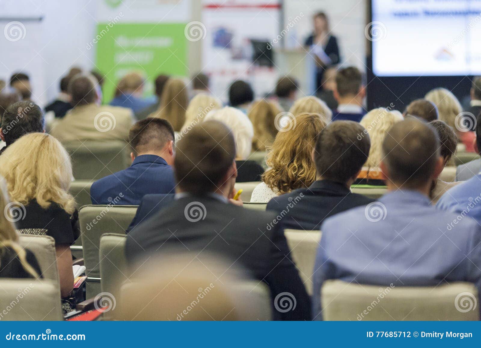 Professional Female Host Speaking in Front of the Audience during ...