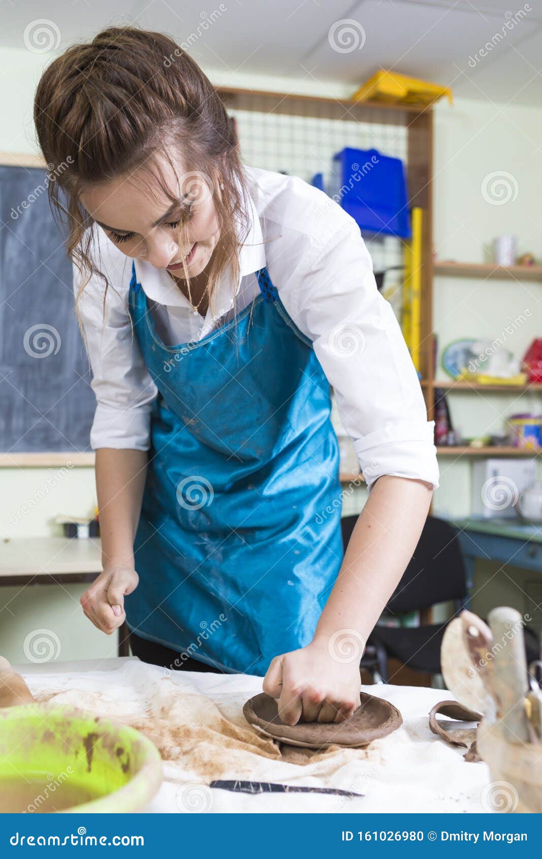 Professional Female Potter Pressing a Piece of Wet Clay with Hands on ...