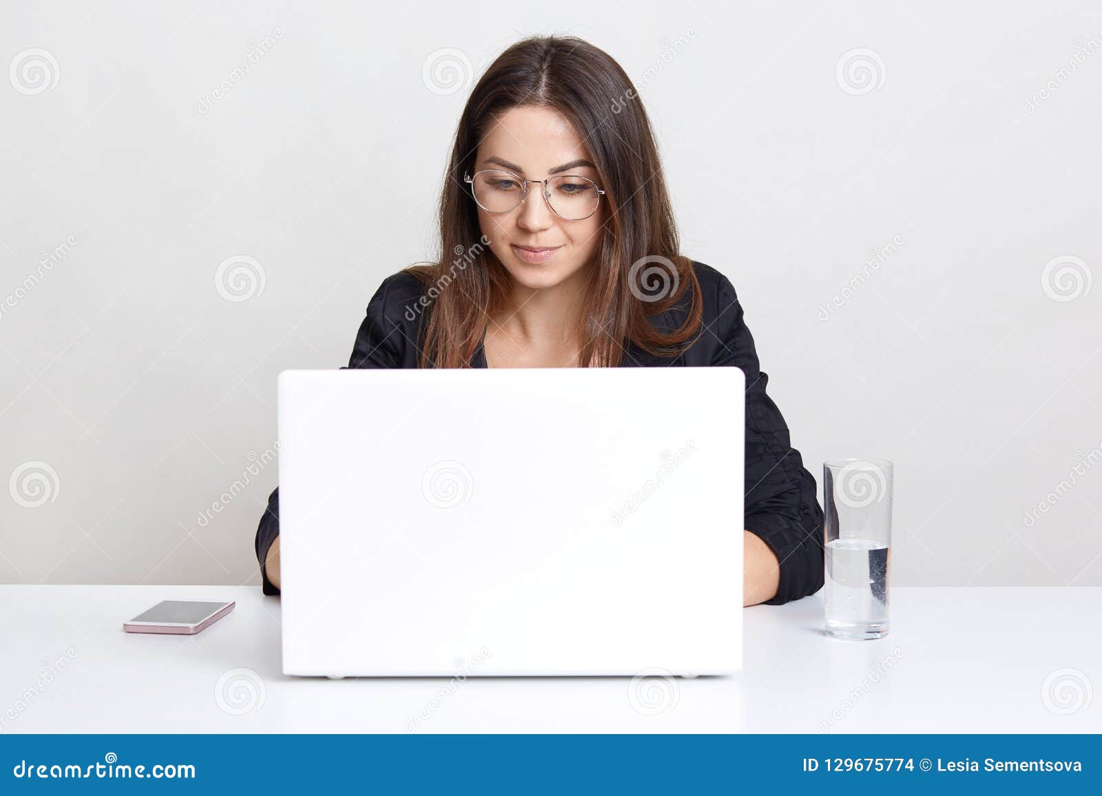 Professional Female Software Developer Works on Laptop Computer ...