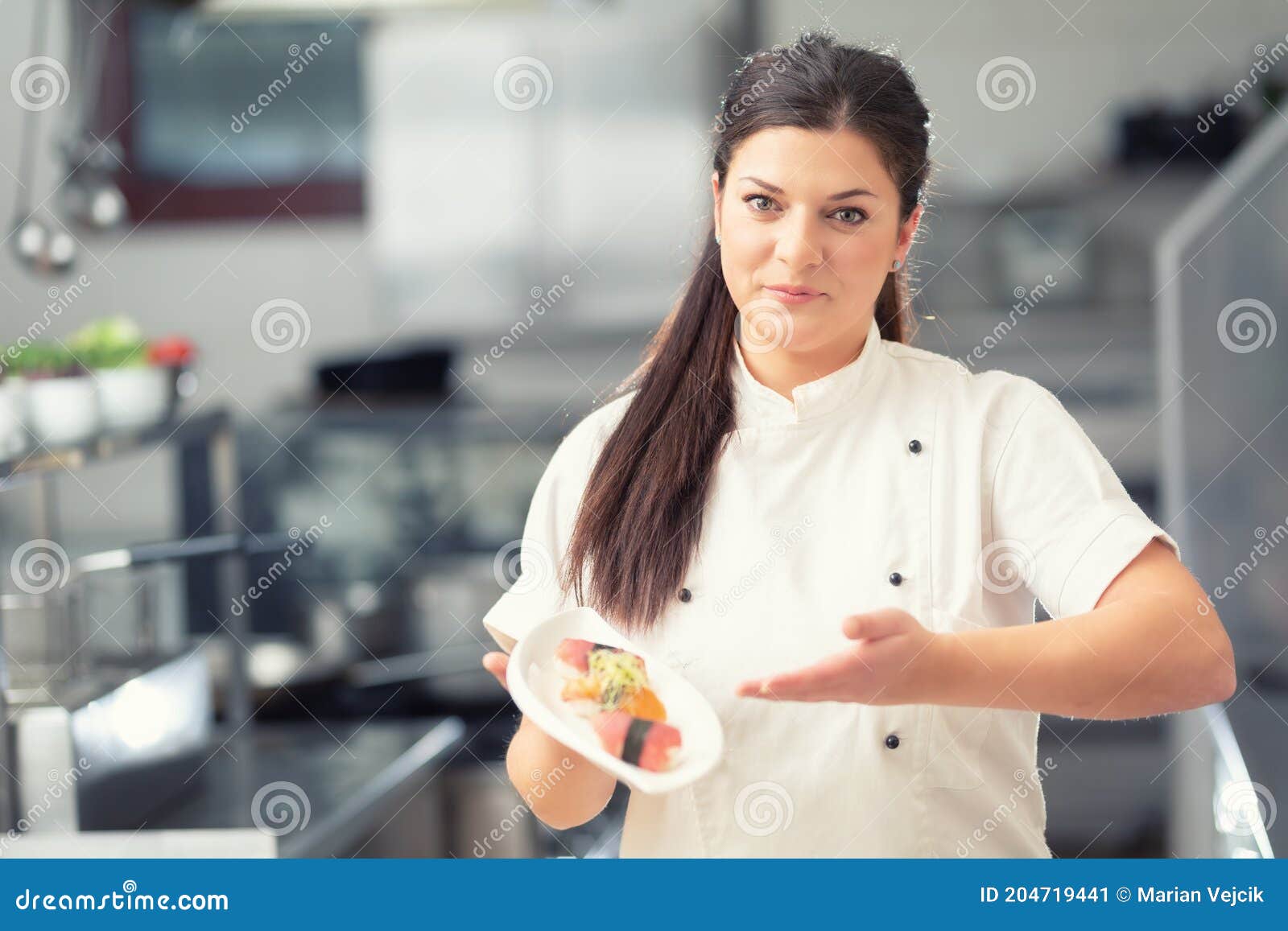 Professional Female Sushi Chef Presents a Dish in a Restaurant Kitchen ...