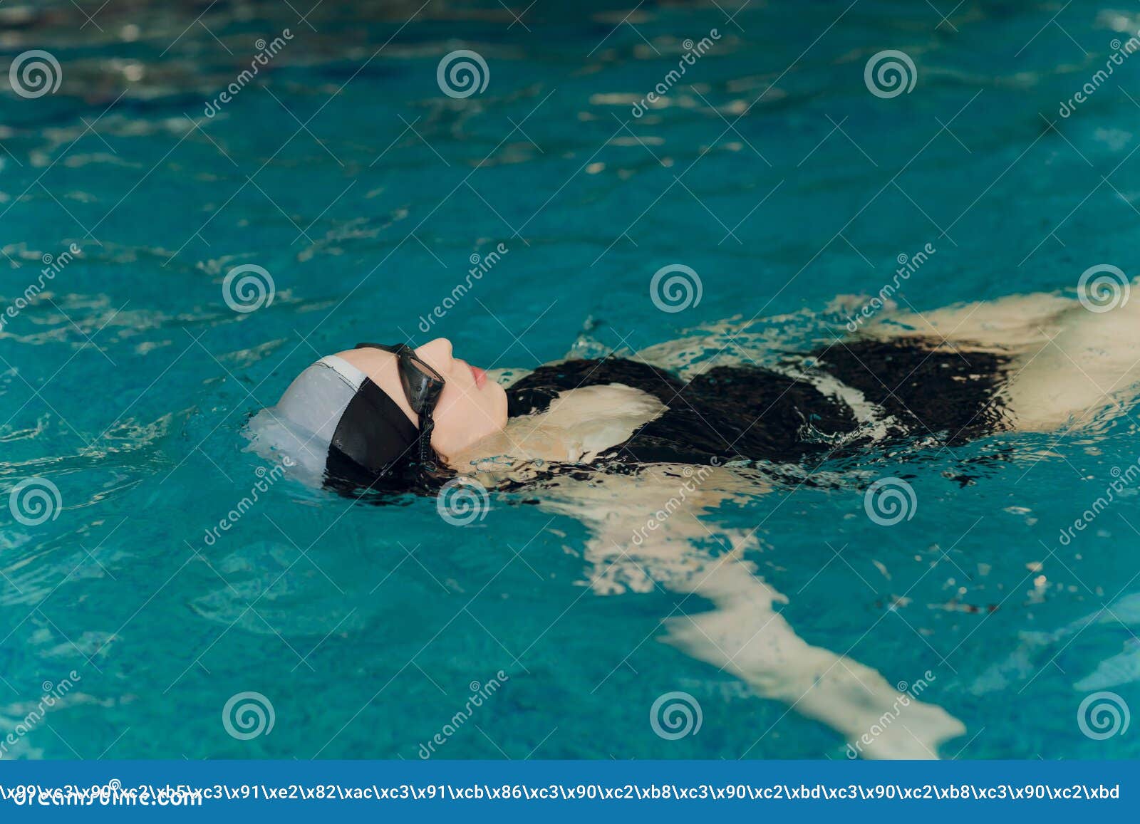 Professional Female Swimmer Training in a Swimming Pool. Stock Photo ...