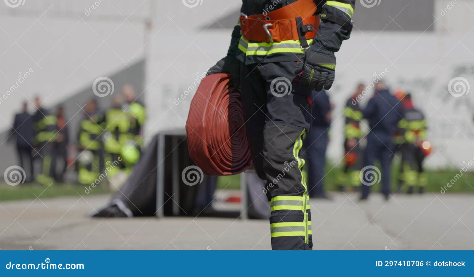 A Professional Firefighter is Seen Diligently Cleaning and Storing Fire ...