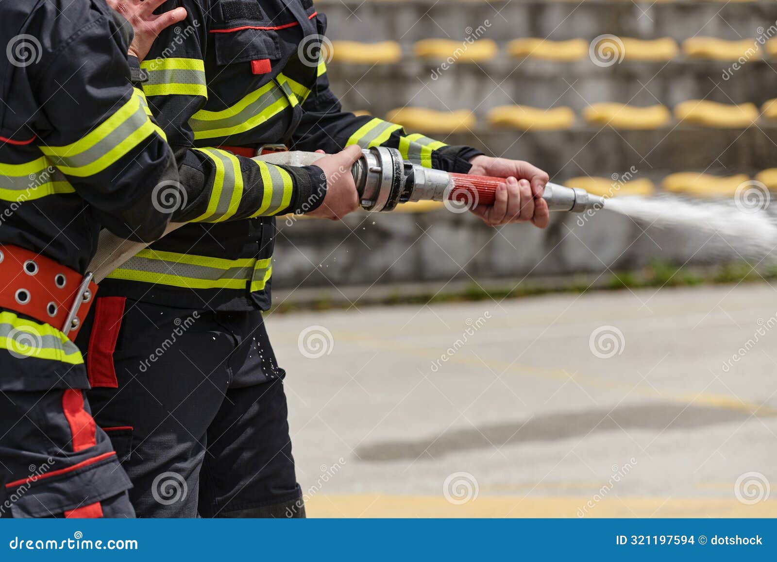 Professional Firefighters Training with Water Hose Stock Photo - Image ...