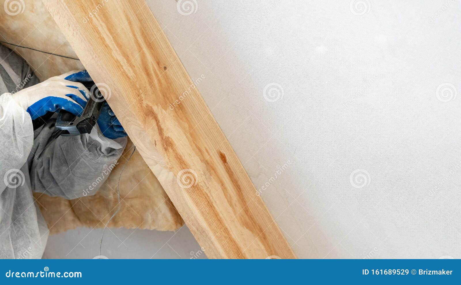 Professional Foreman Installing Thermal Insulation Layer Under the Roof ...