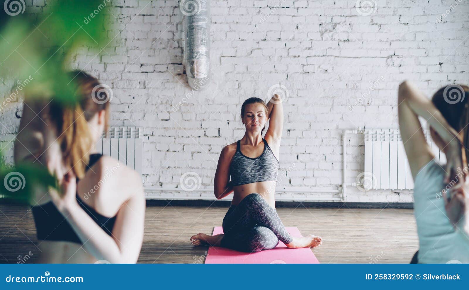 Professional Yoga Teacher is Demonstrating Arm Locks in Cow Face Pose ...