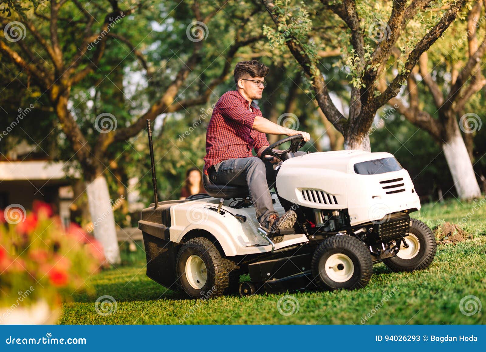 Professional Gardner Using Lawn Mower and Cutting Grass Stock Image ...