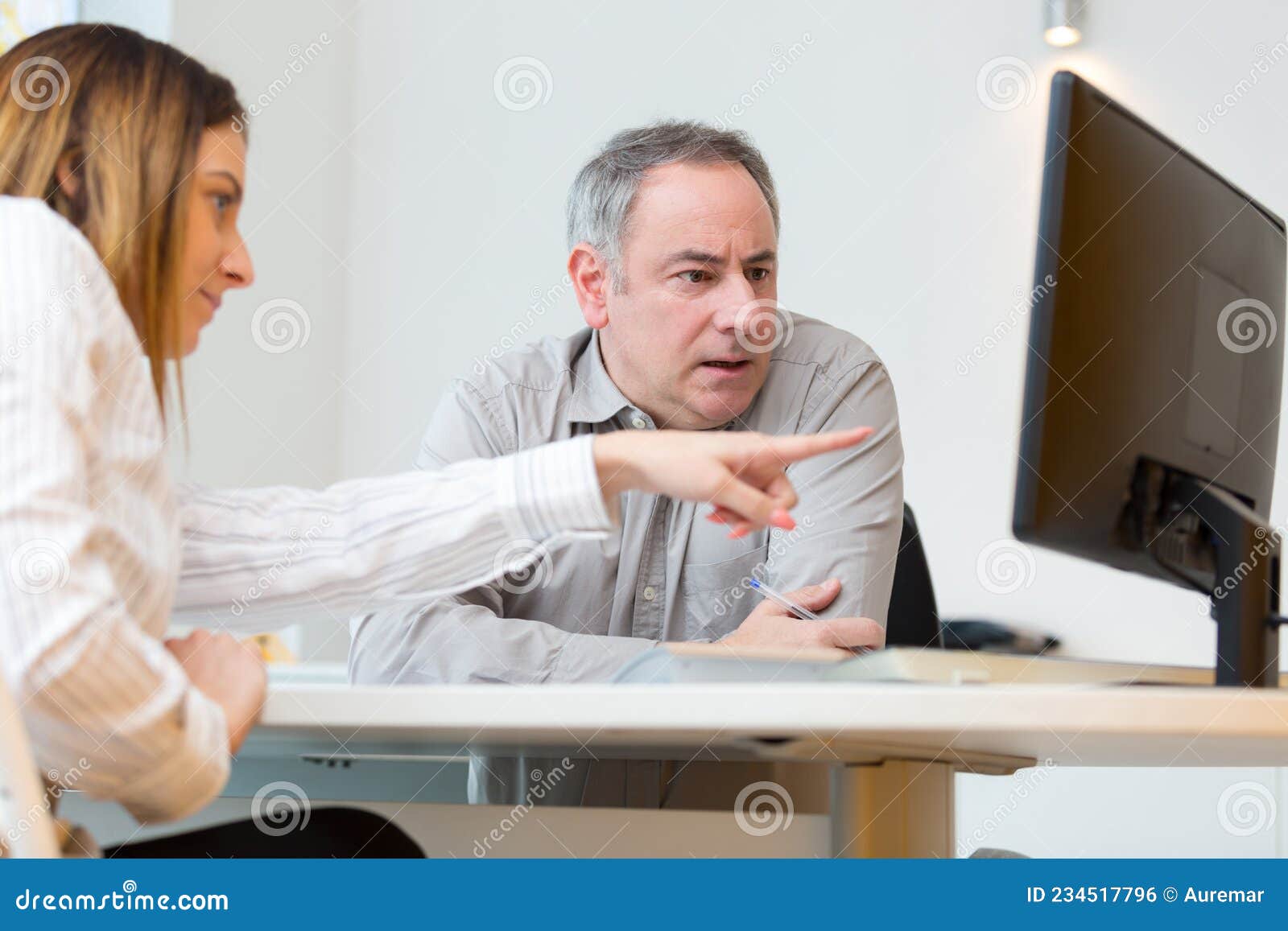 Professional Graphic Designer Showing Computer To Client Stock Photo ...