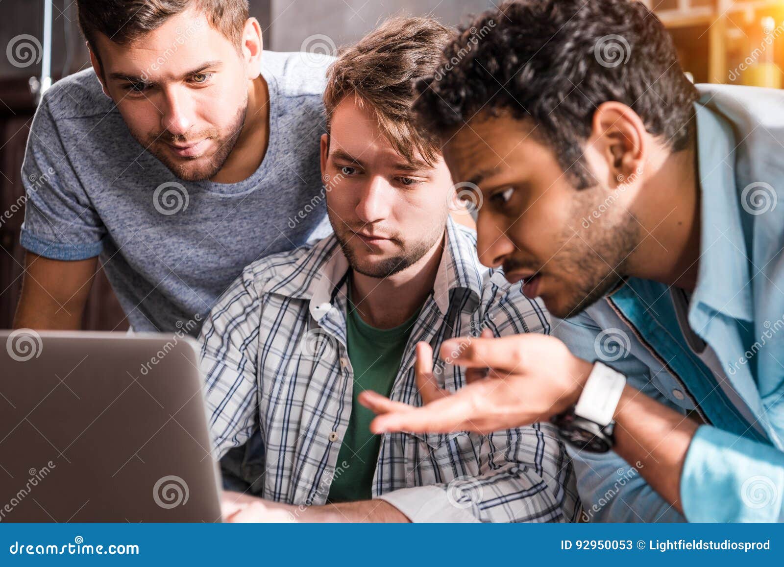 Professional Group Using Laptop and Discussing Business Project ...