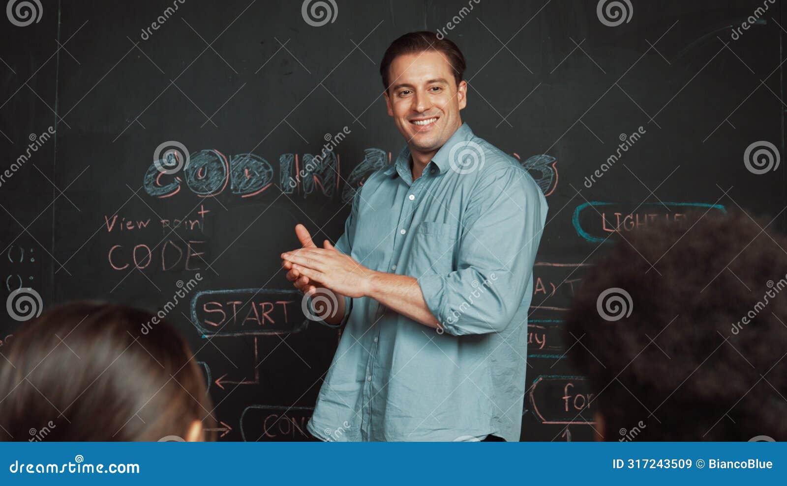 Caucasian Teacher Answering Student Question about Coding Program ...