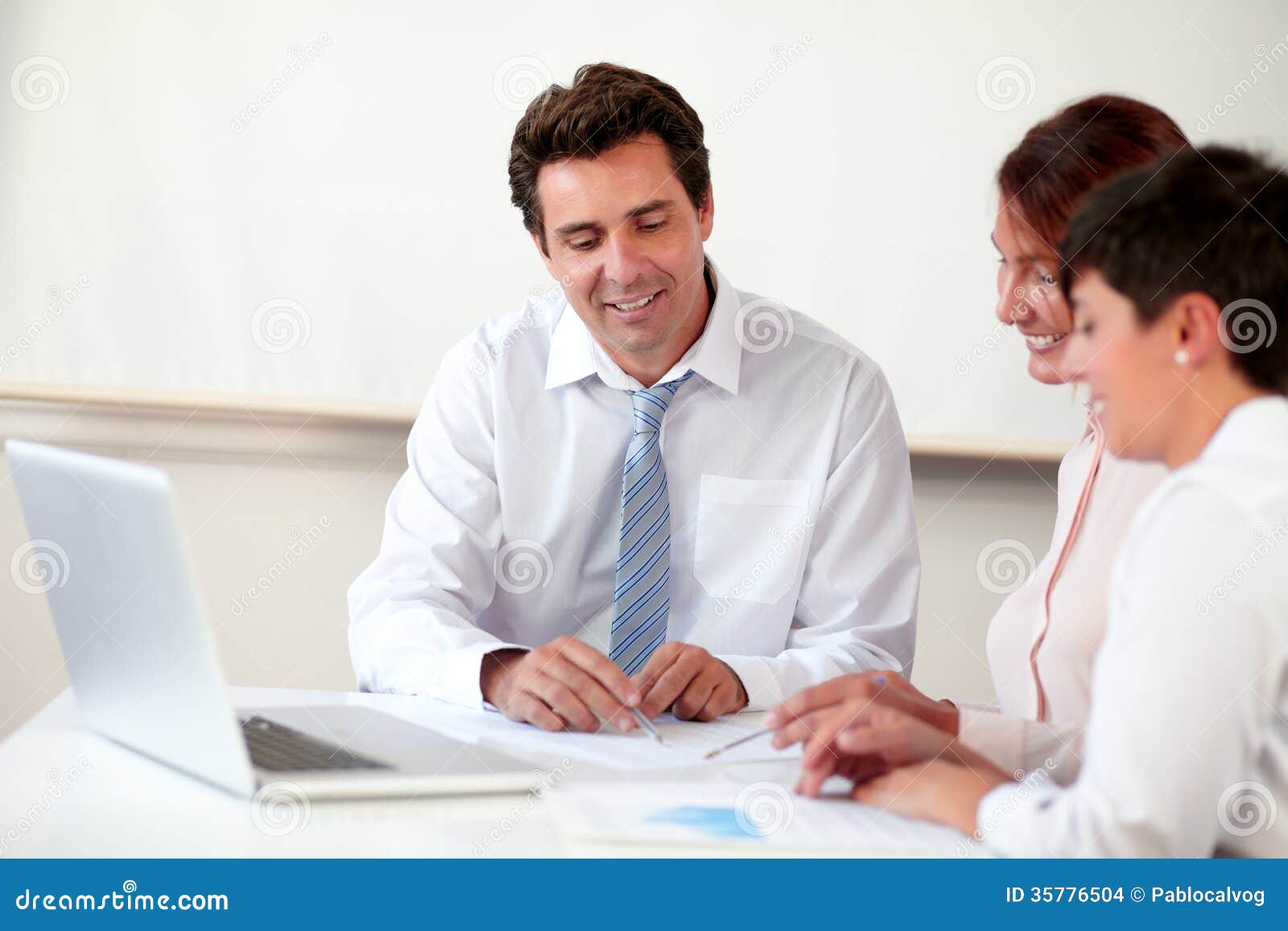 Professional Hispanic Group Working on Documents Stock Photo - Image of ...