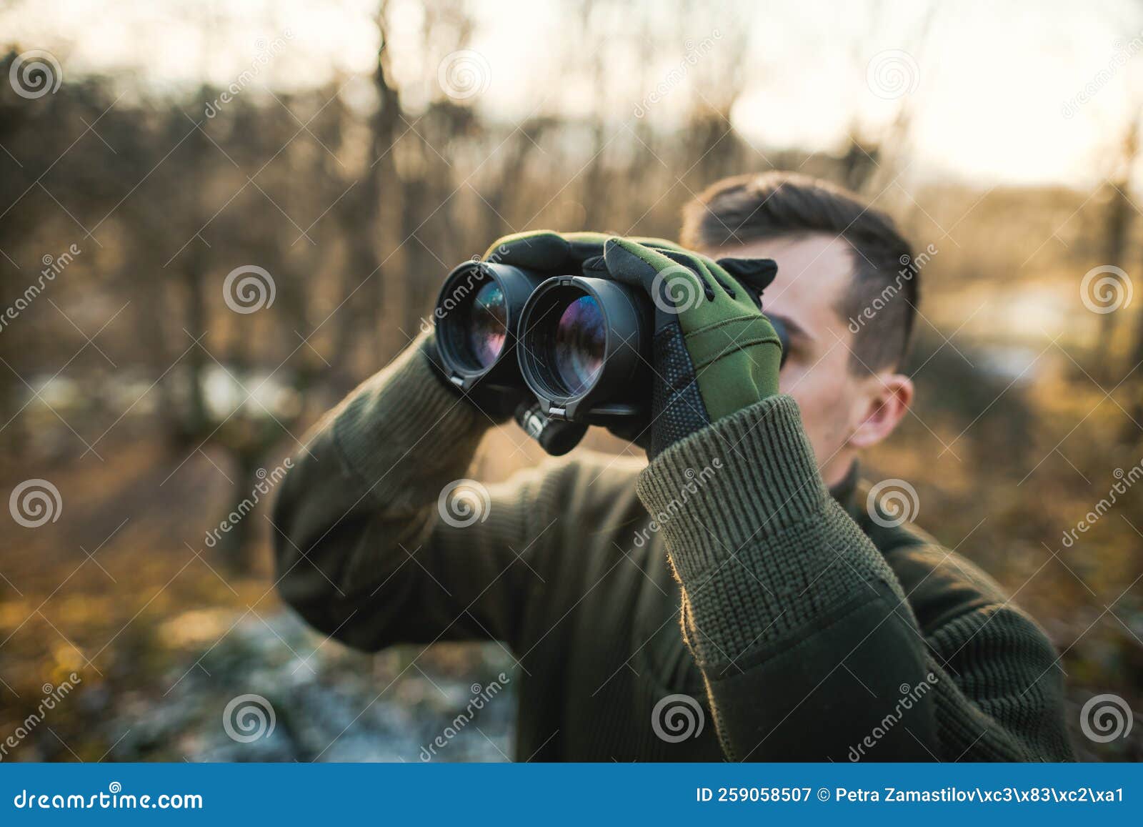 Professional Hunter Looking through Binoculars. Man on the Hunt in the ...