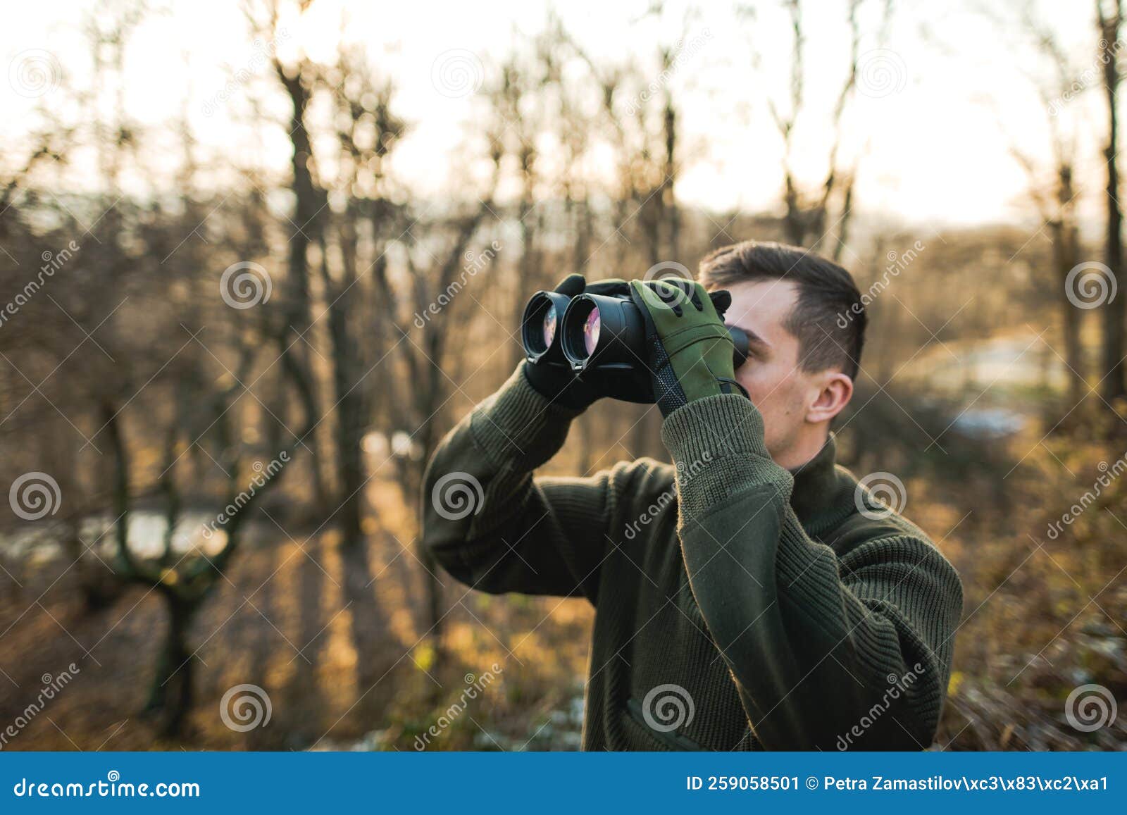 Professional Hunter Looking through Binoculars. Man on the Hunt in the ...