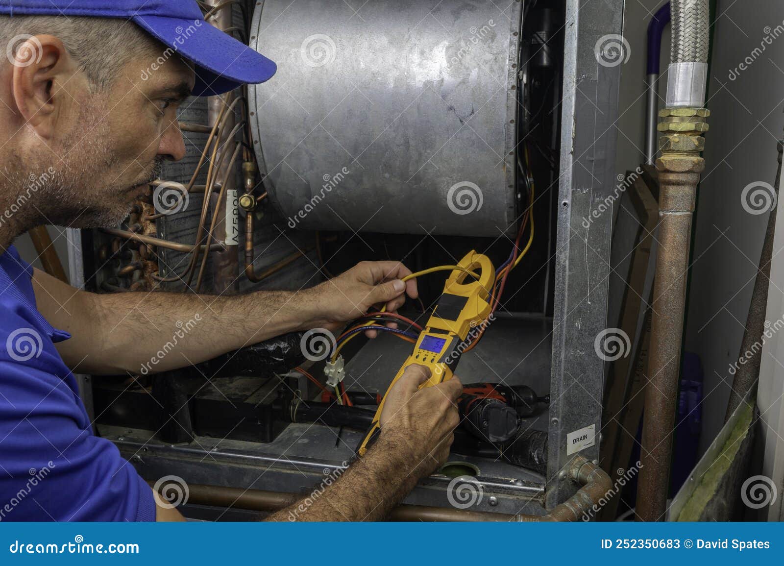 Professional Hvac Technician Checking Current on Motor Wire Stock Image ...