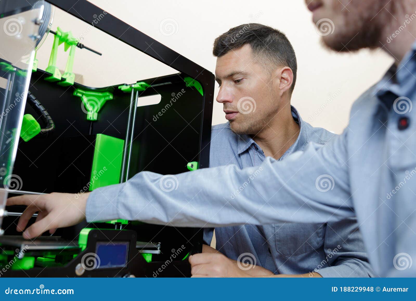 Professional Industrial Engineers Adjusting Modern Machine Settings ...