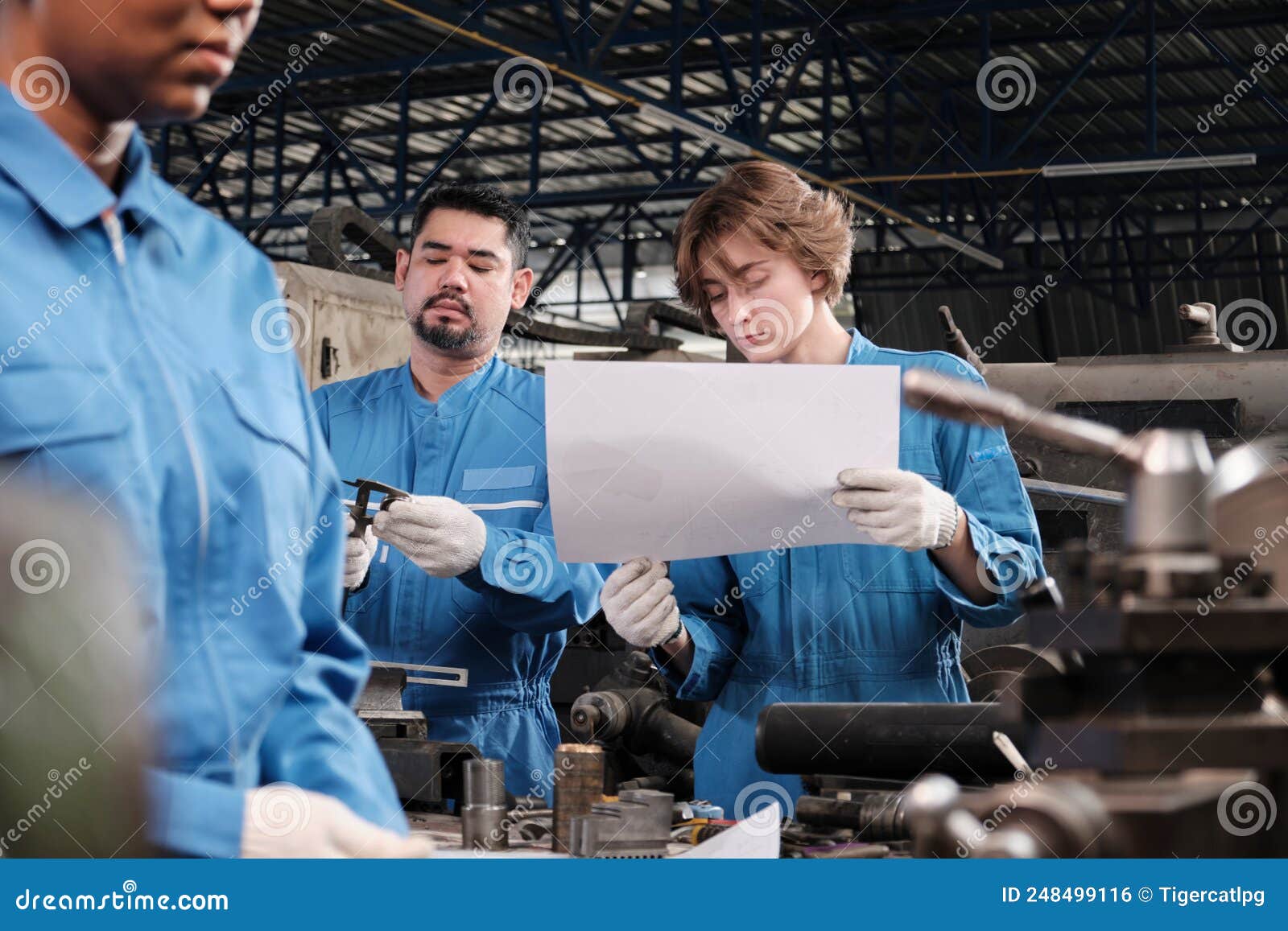 Professional Workers Teams Work in the Metalwork Manufacturing Factory ...
