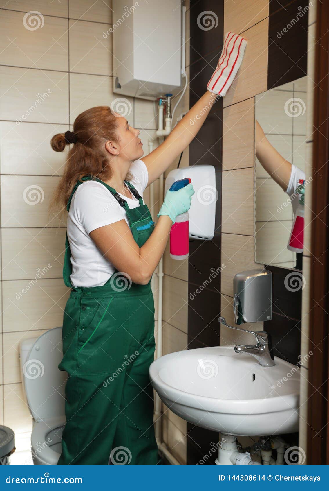 Professional Janitor Cleaning Wall in Restroom Stock Photo - Image of ...