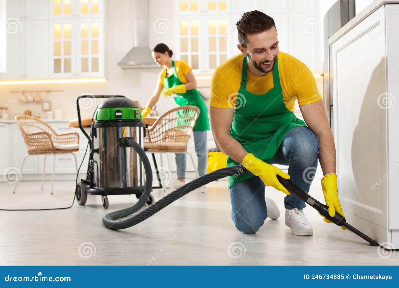 Professional Janitor in Uniform Vacuuming Floor Indoors Stock Image ...