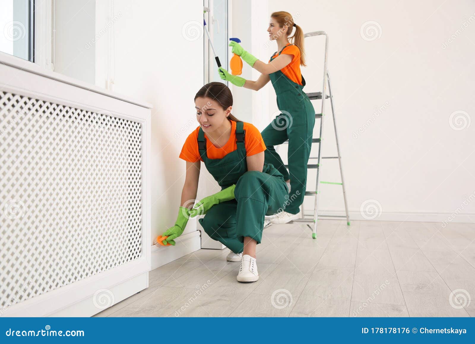 Professional Janitors in Uniforms Cleaning Room Stock Photo - Image of ...