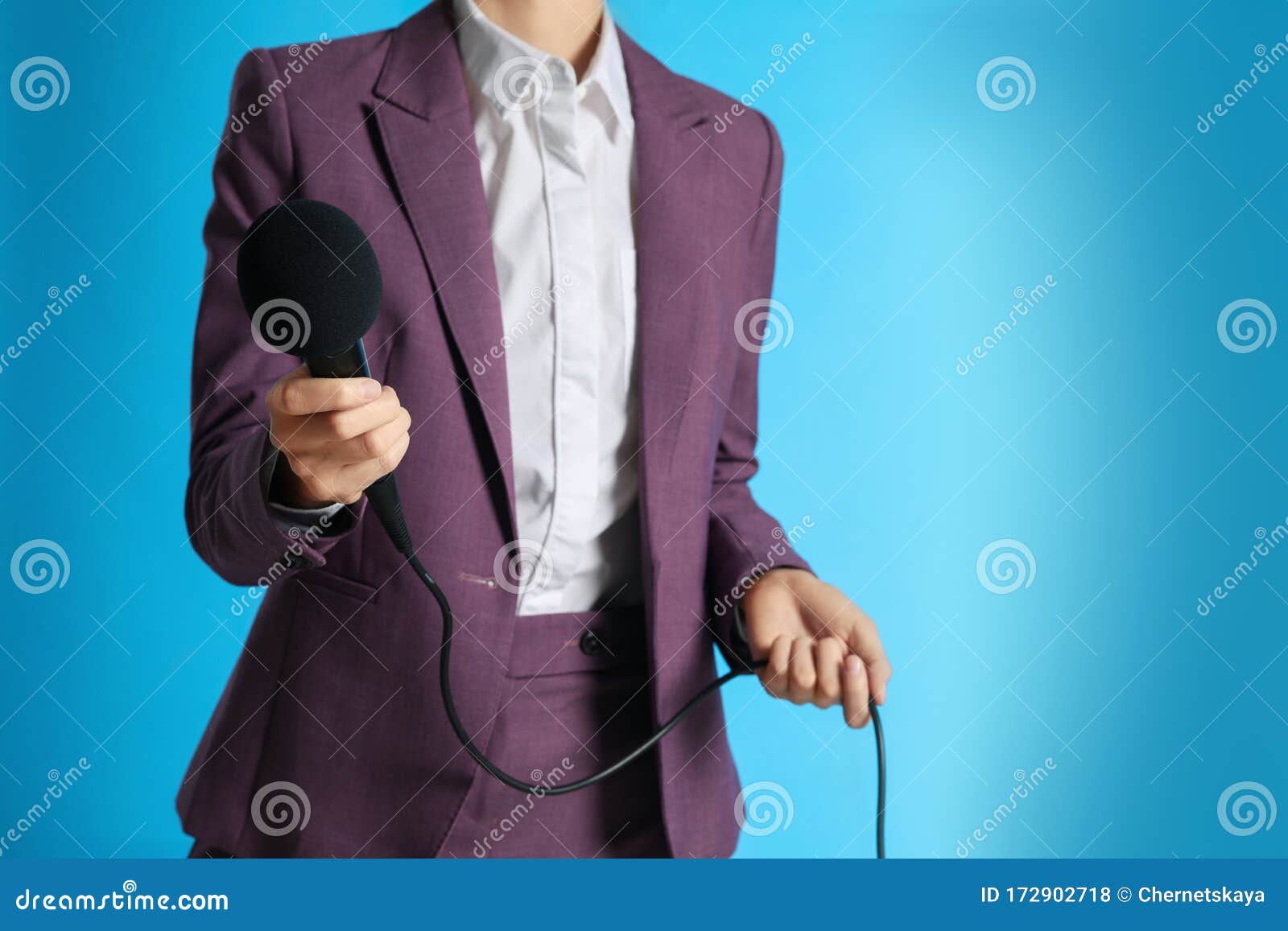 Professional Journalist with Microphone on Blue Background, Closeup ...