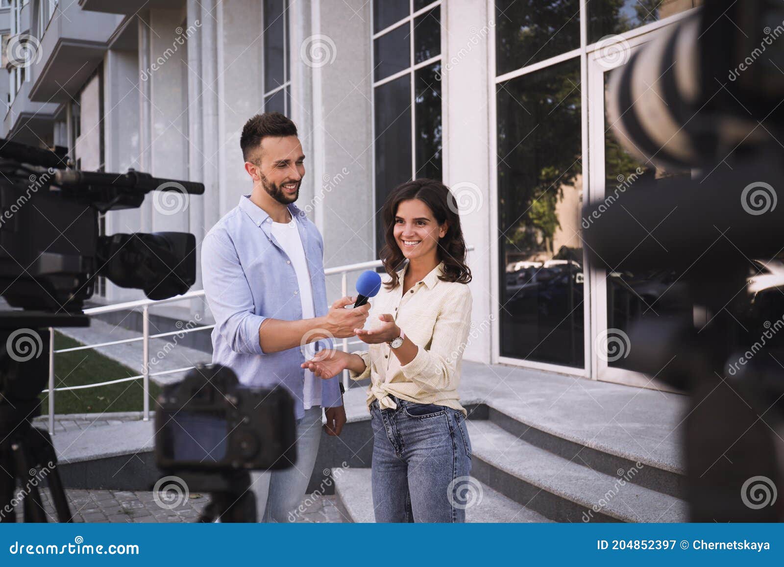 Professional Journalist Taking Interview in Front of Video Cameras ...