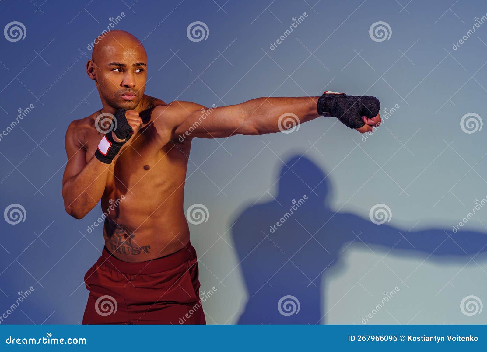Professional Kickboxer is Training and Practicing Punch on Studio ...